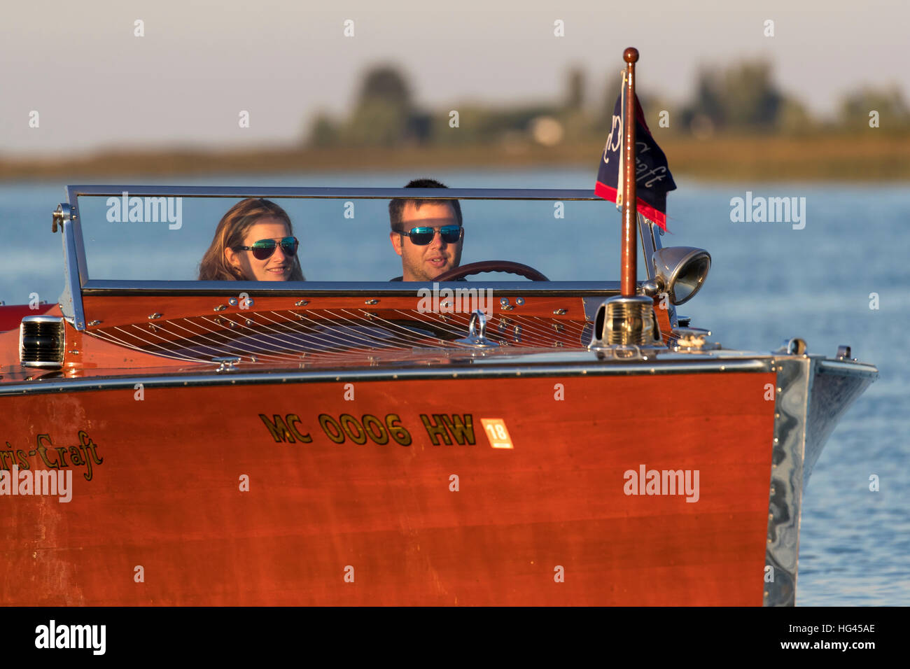 Woman driving boat hi-res stock photography and images - Alamy
