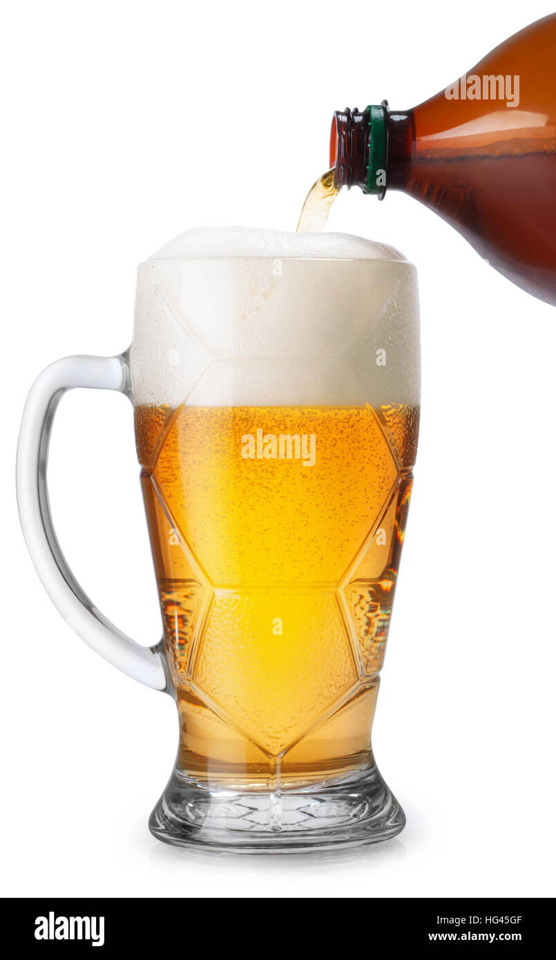 light beer is pouring of the bottle into glass isolated on white ...