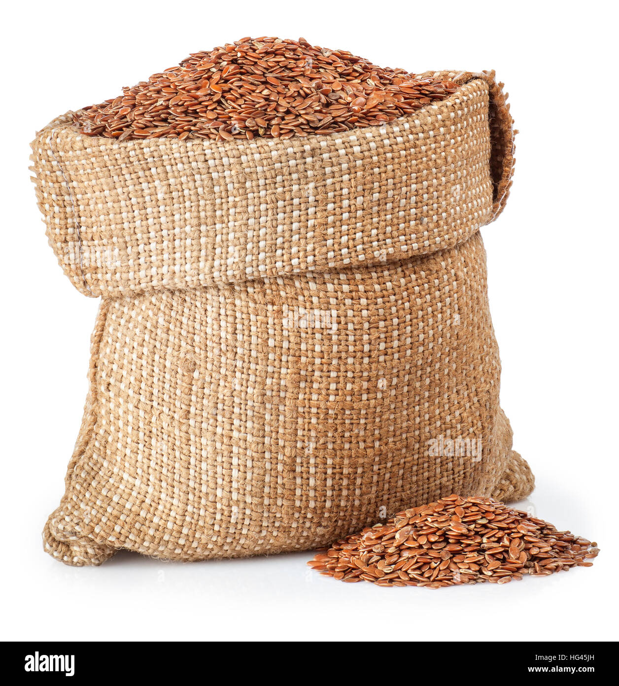 full burlap bag with flax seed and heap of flax seed isolated on white ...