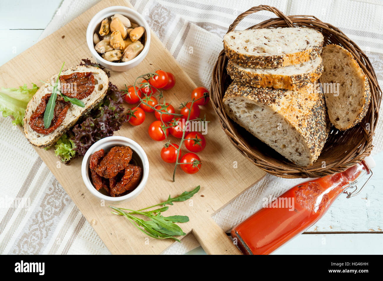 Sandwich with sun-dried tomatoes and arugula, sun-dried tomatoes, fresh ...