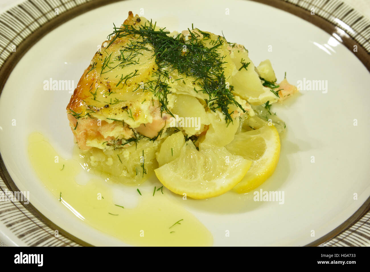 Plate with Salmon pudding with dill, lemon and melted butter, picture ...