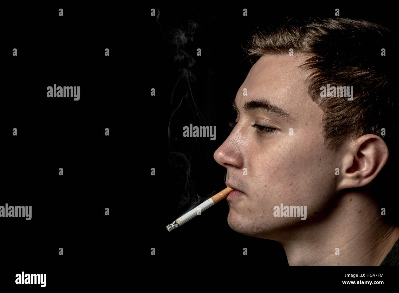 Teenage Boy Smoking Stock Photo - Alamy