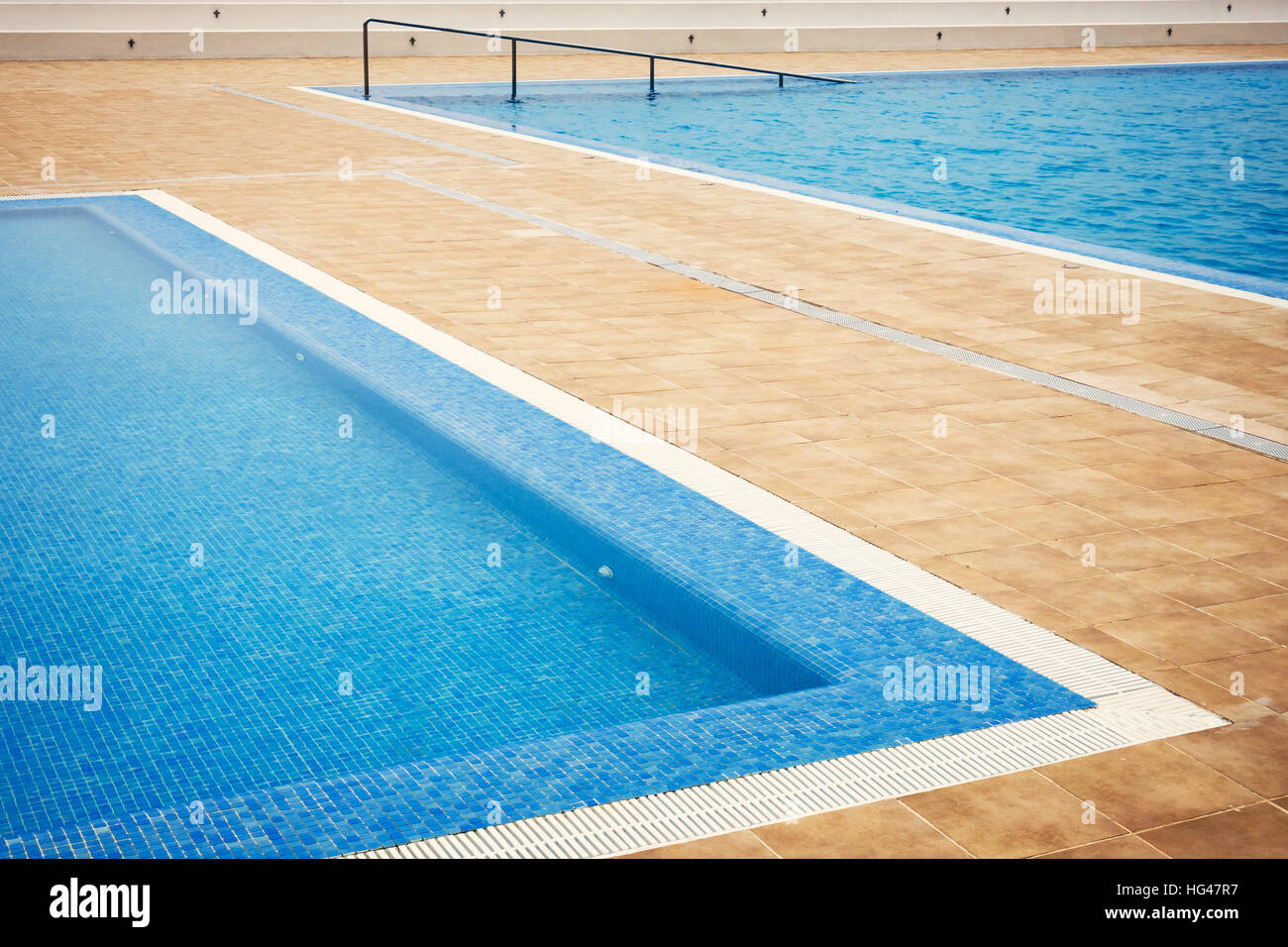 close up of two swimming pools with blue transparent water Stock Photo ...