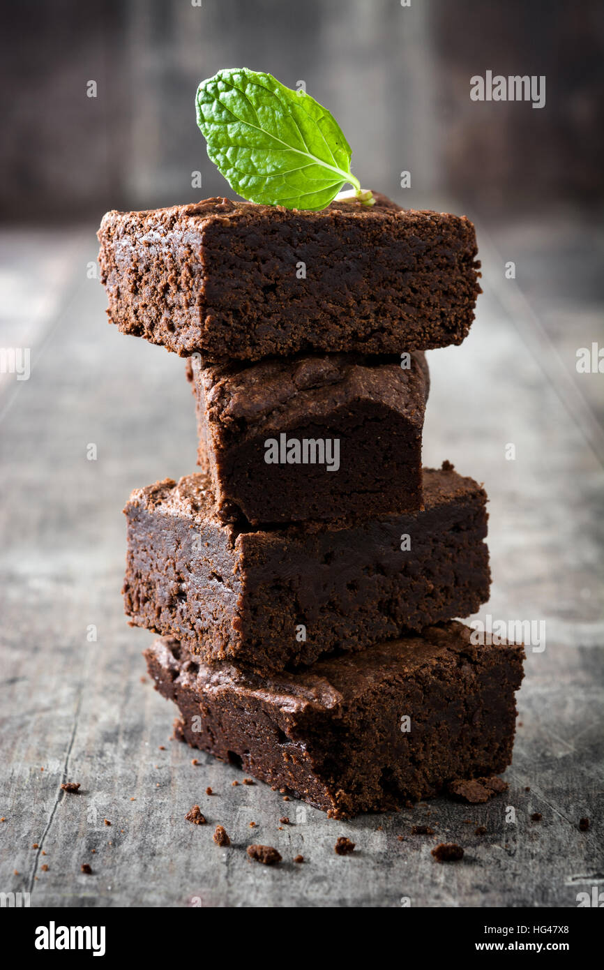 Chocolate brownie portions on wooden background Stock Photo - Alamy