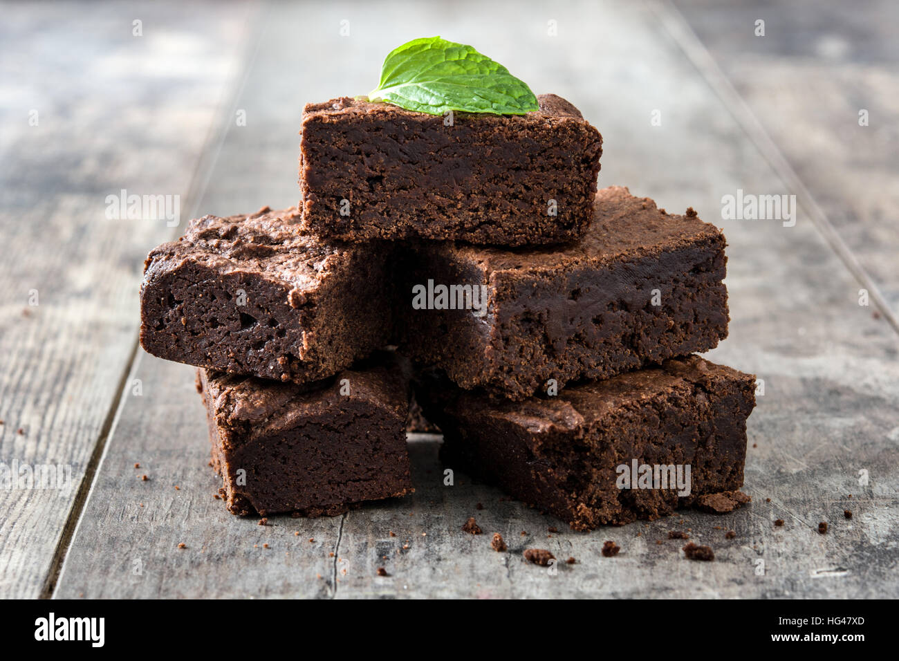 Chocolate brownie portions on wooden background Stock Photo - Alamy