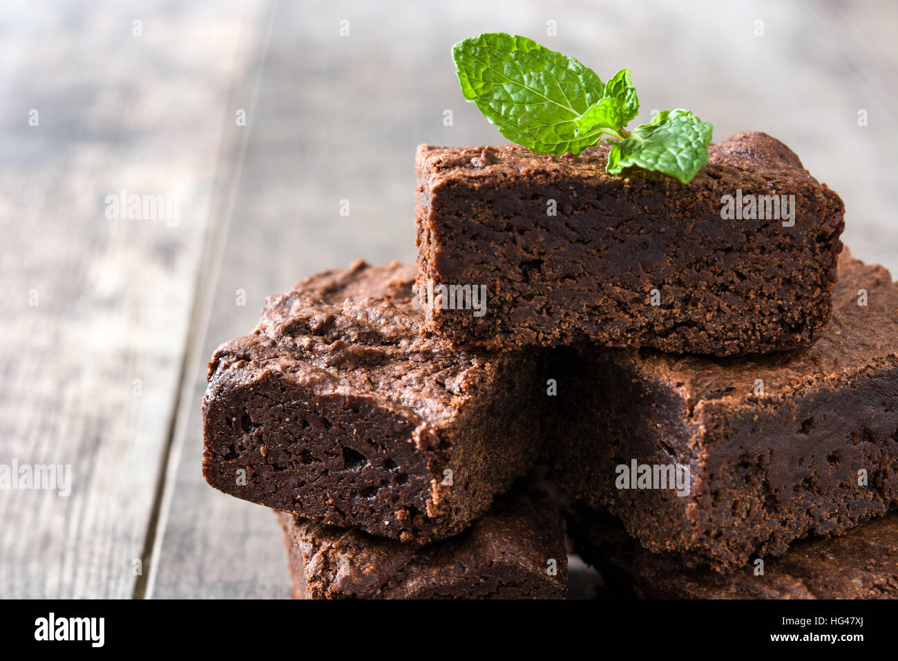 Chocolate brownie portions on wooden background Stock Photo - Alamy