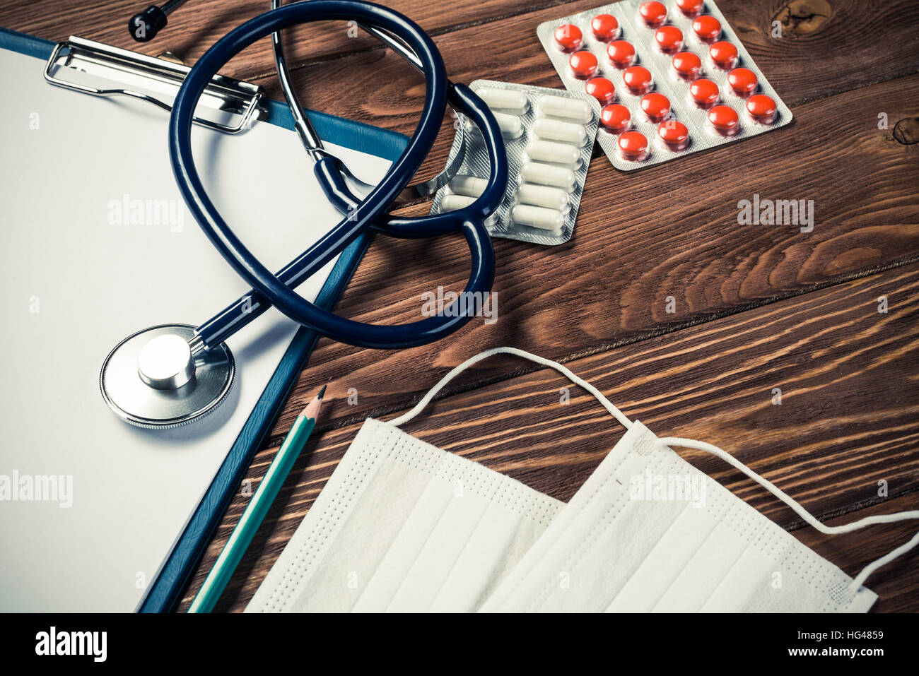 Desk of doctor with medicine things Stock Photo - Alamy