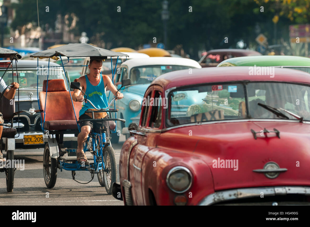 HAVANA, CUBA - JUNE, 2011: Cubans share the streets with classic ...