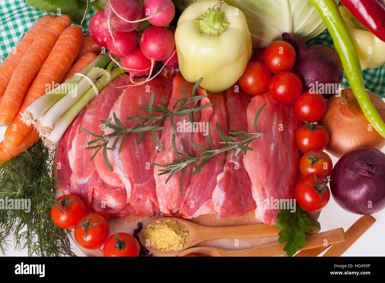 fresh pork meat with vegetables on wooden board Stock Photo - Alamy