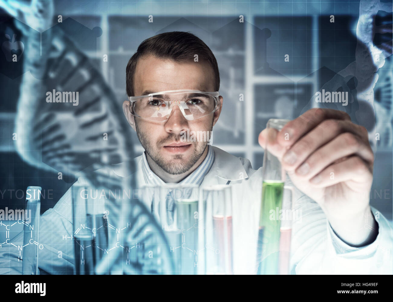 Young scientist mixing reagents in glass flask in clinical laboratory ...
