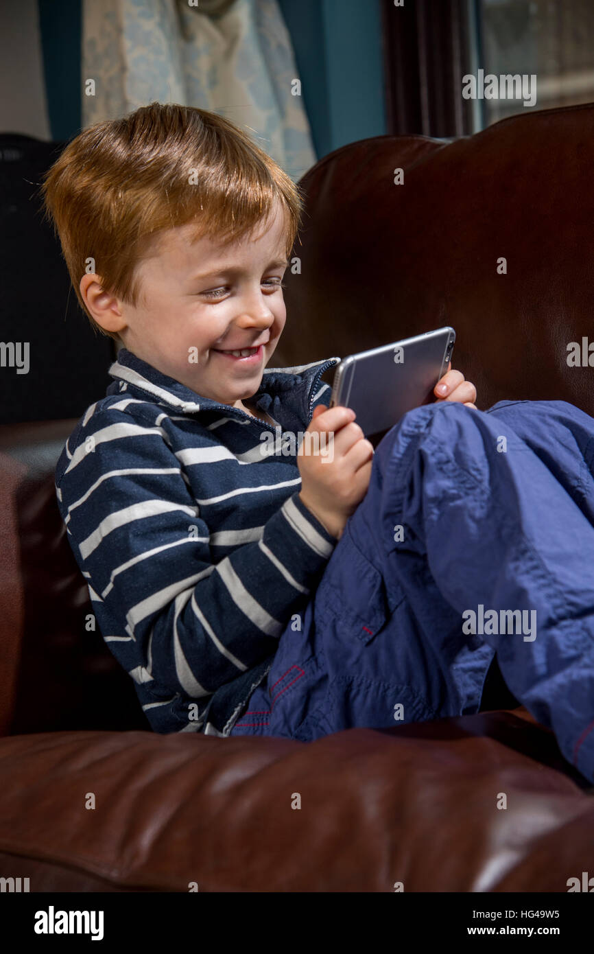 Iphone child hand hi-res stock photography and images - Alamy