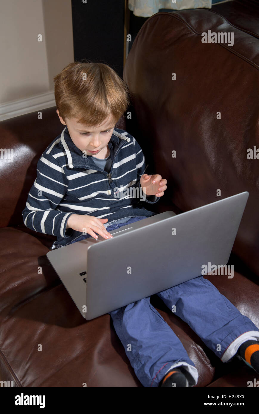 Child using pc hi-res stock photography and images - Alamy