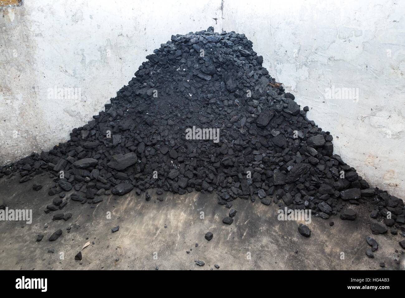Black coal lying on a pile in house basement. Fuel material Stock Photo ...