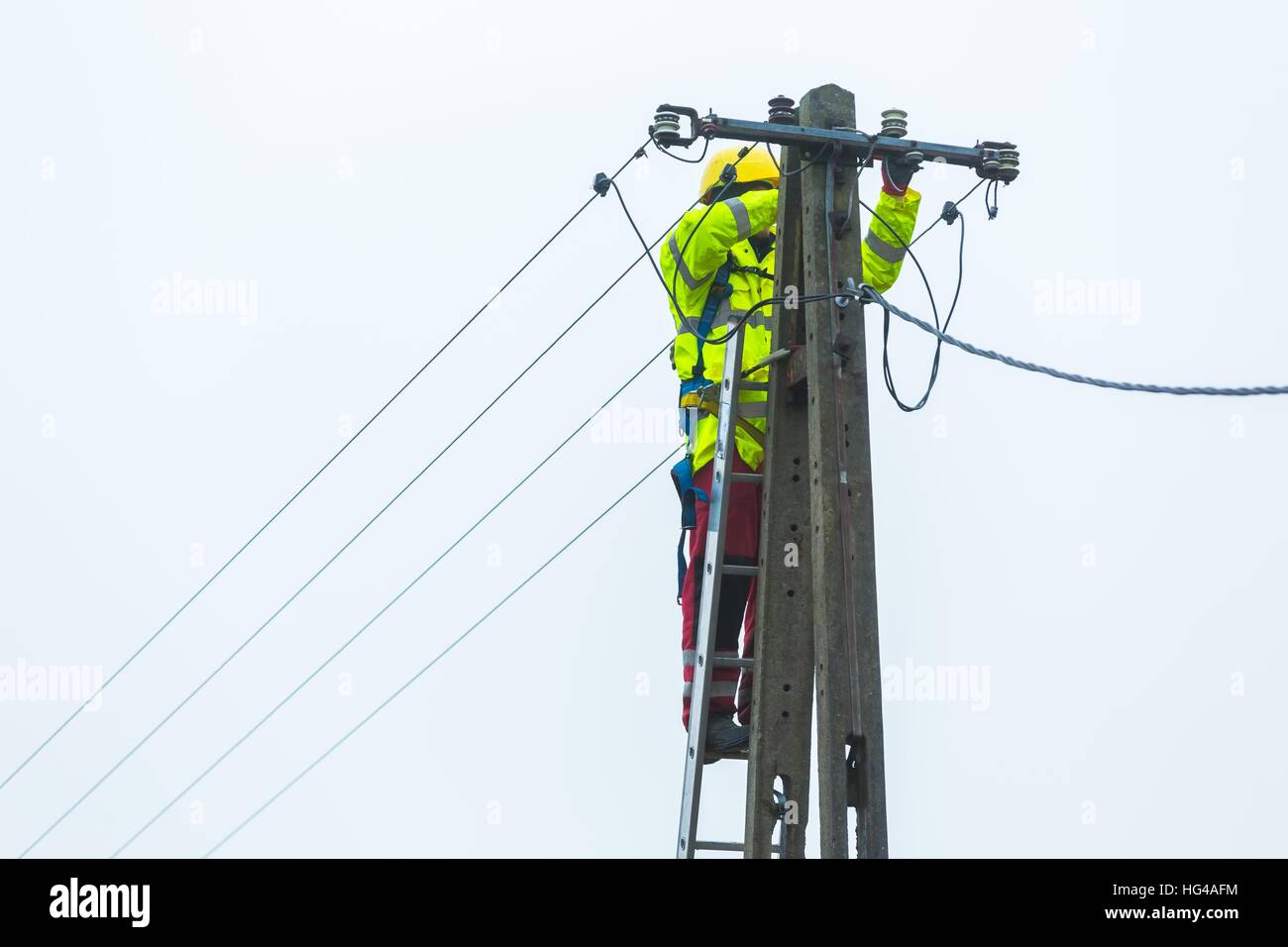 Electrician working on power lines. Failure of power lines on power ...