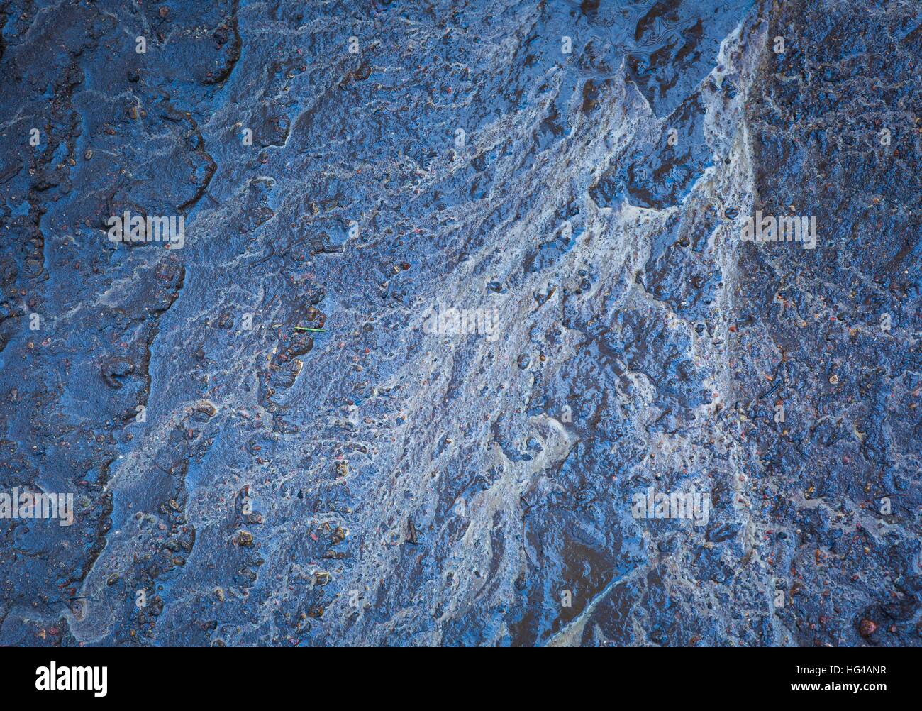 Abstract patterns in mud from puddle. Natural abstraction of dirty ...