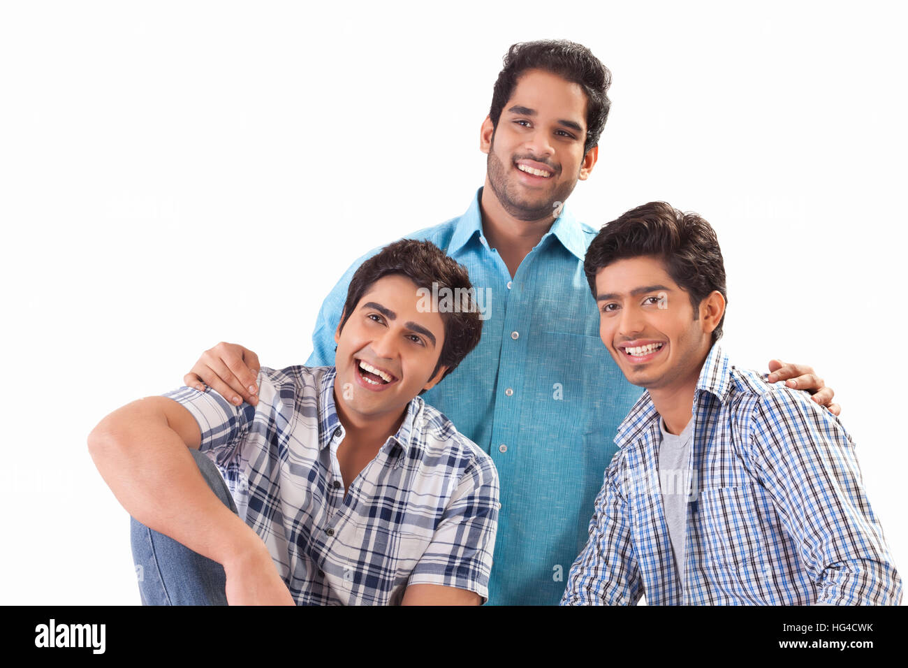 Three friends laughing Stock Photo - Alamy