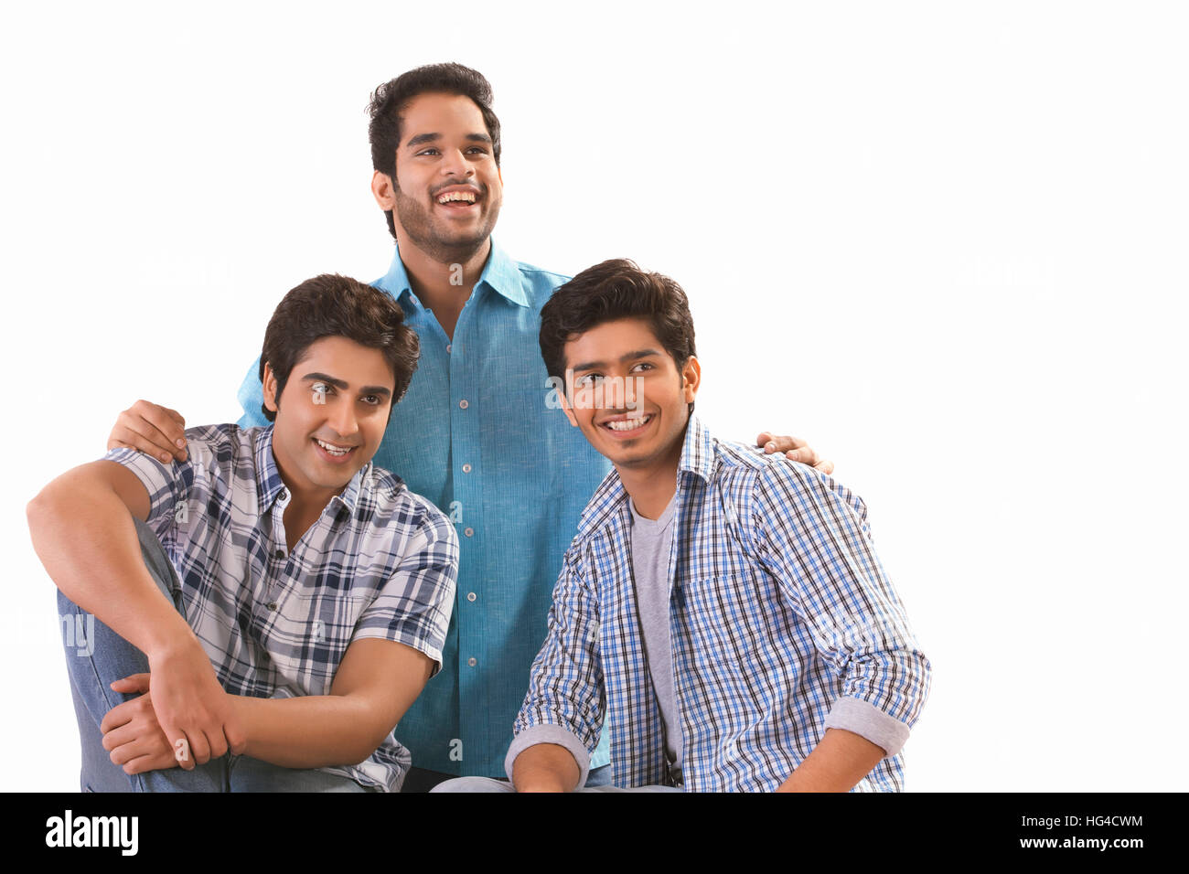 Three friends laughing Stock Photo - Alamy