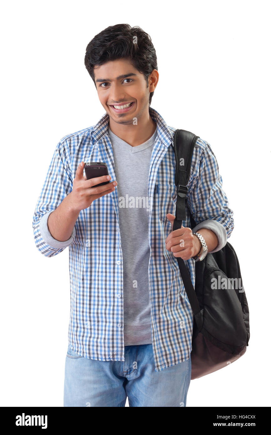 Smiling male college student using mobile phone Stock Photo - Alamy
