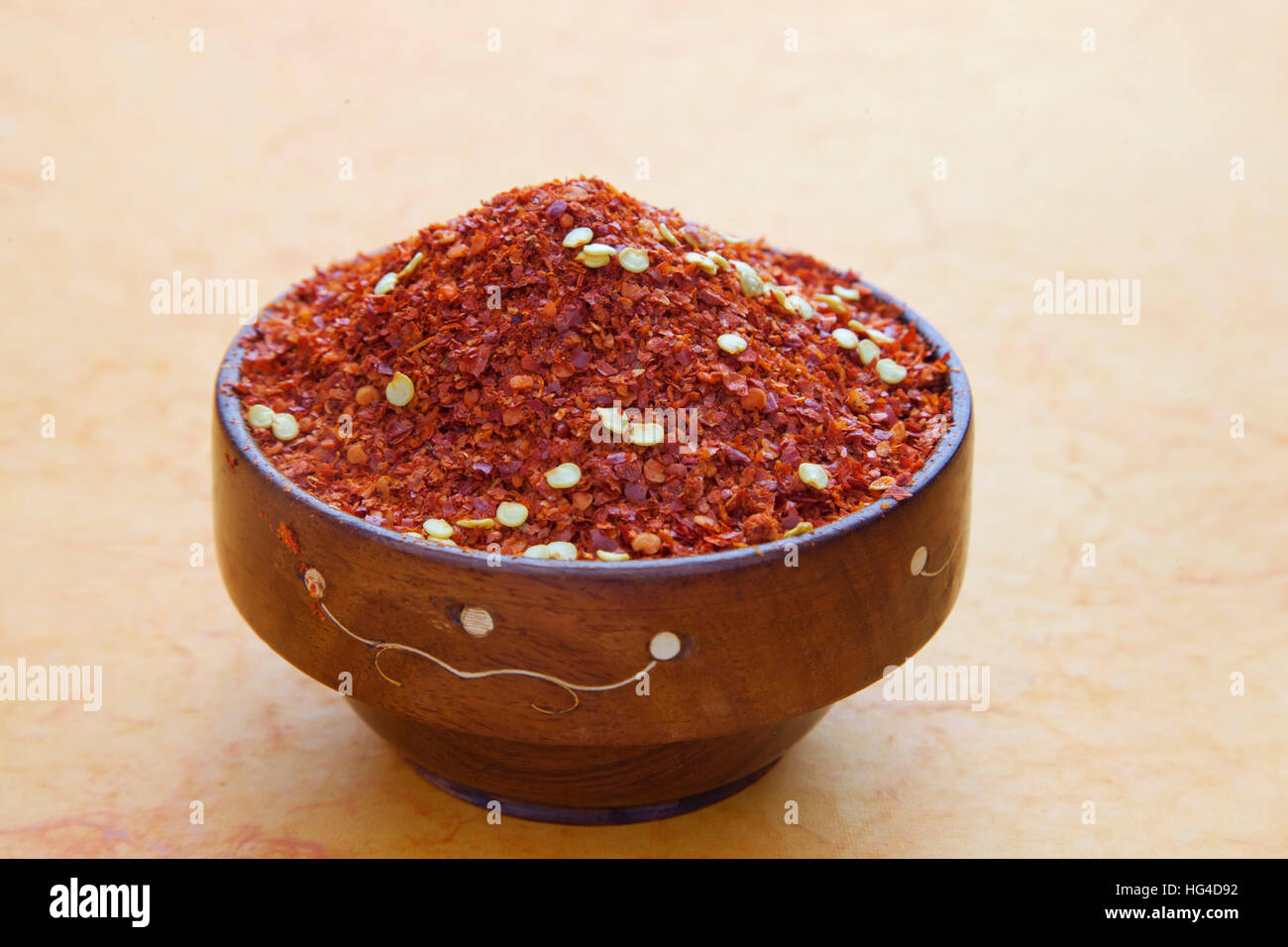 Chilli powder in wooden bowl Stock Photo - Alamy