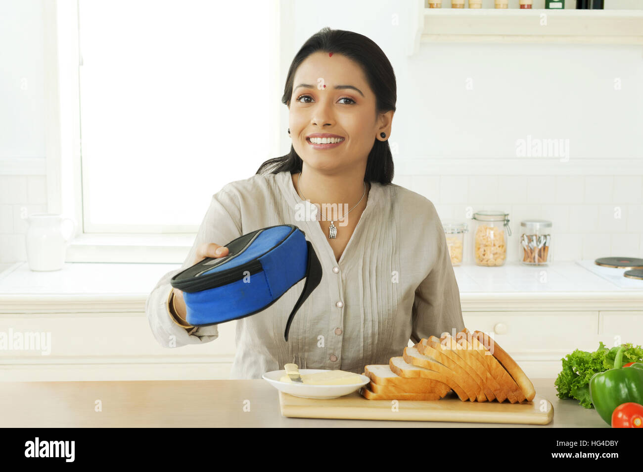 Mother preparing lunch box Stock Photo - Alamy