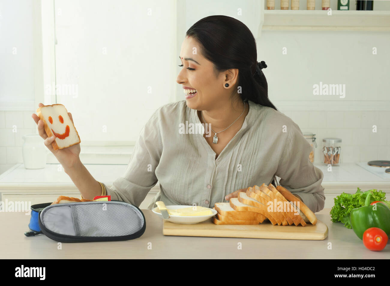 Mother preparing lunch box Stock Photo - Alamy