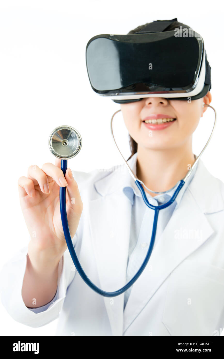 asian female doctor use stethoscope with virtual reality. VR headset ...