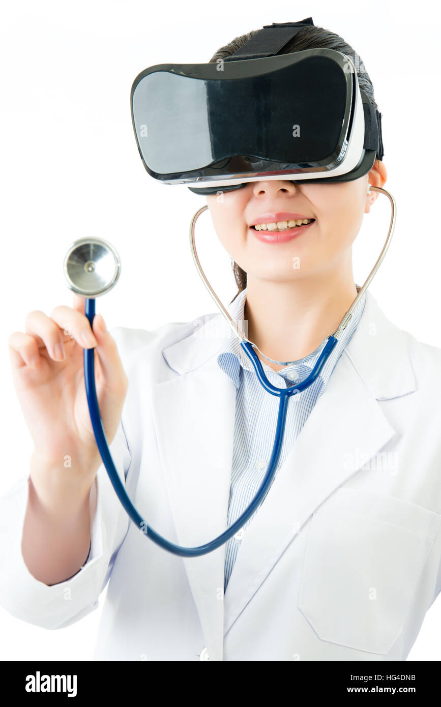 asian female doctor use stethoscope with virtual reality. VR headset ...