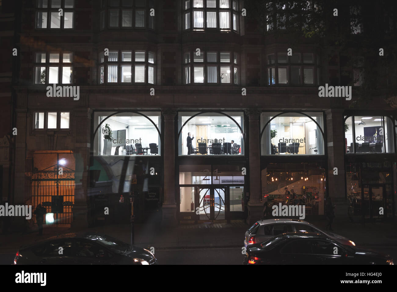 London; In meeting working late at night view through the window from ...