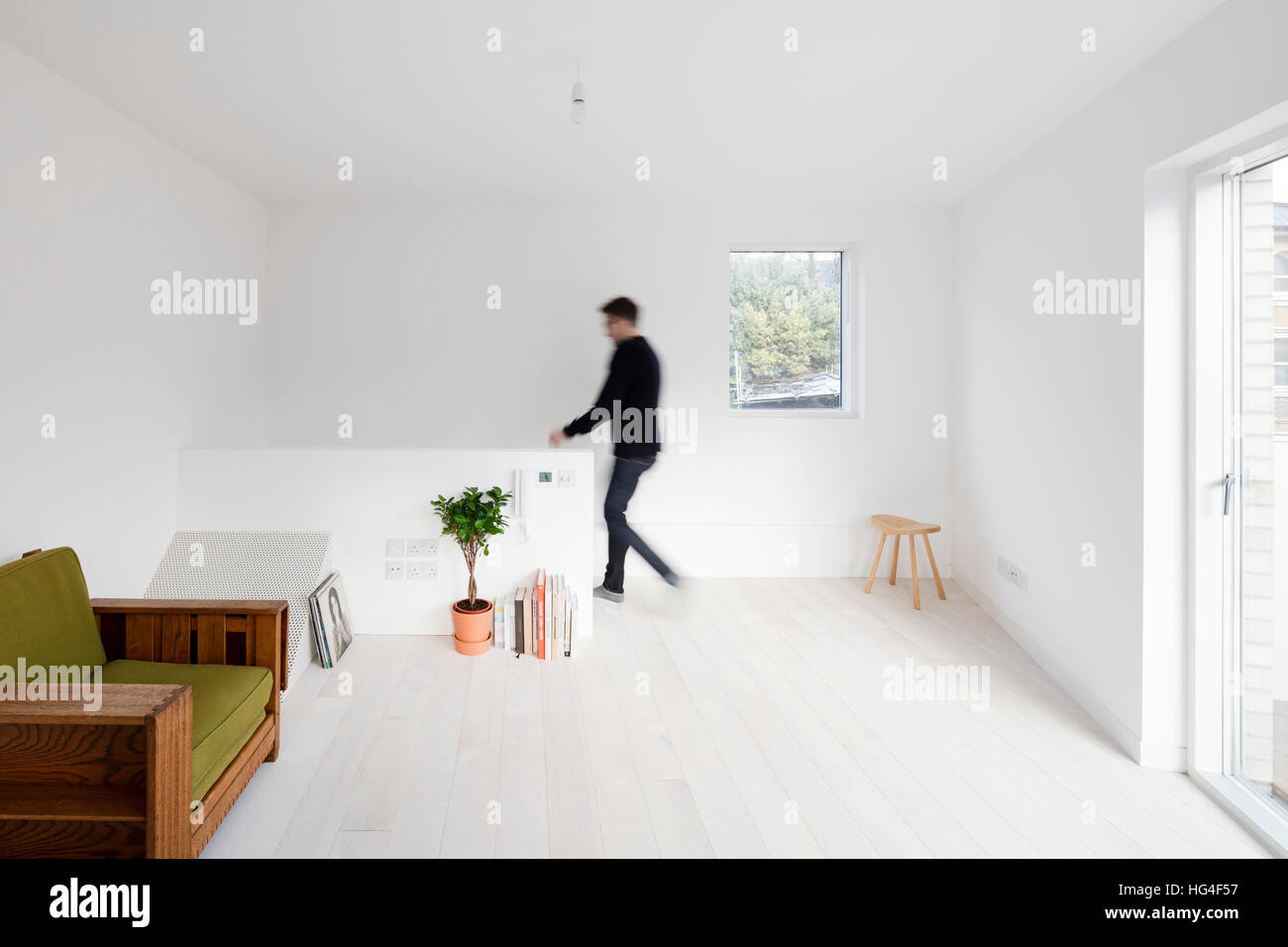 View of main living space and person going down stairs. One Bed House ...