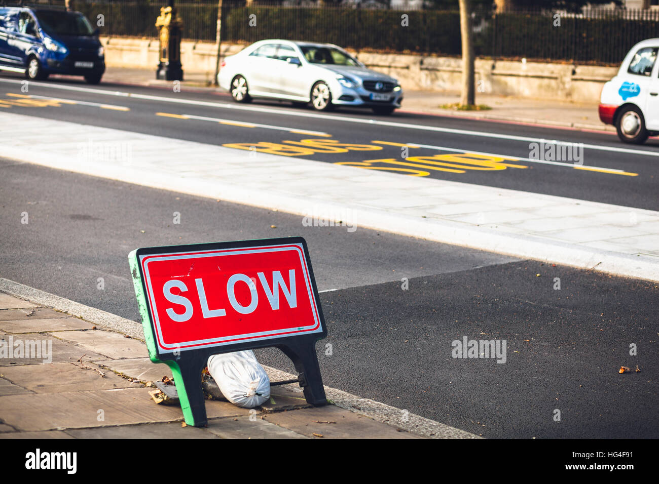 Slow panel red sign indicator for bicyclists on a track cycling Stock ...