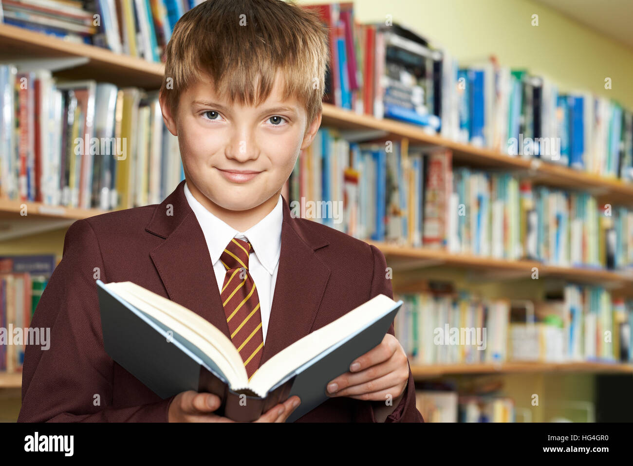 Wearing uniform in library reading hi-res stock photography and images ...