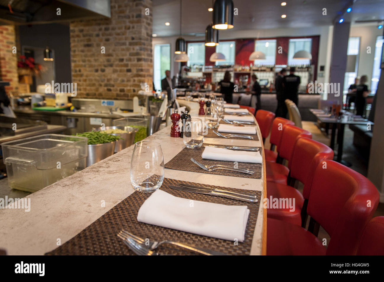 A circular bar with place settings ready for lunch overlooking the open ...