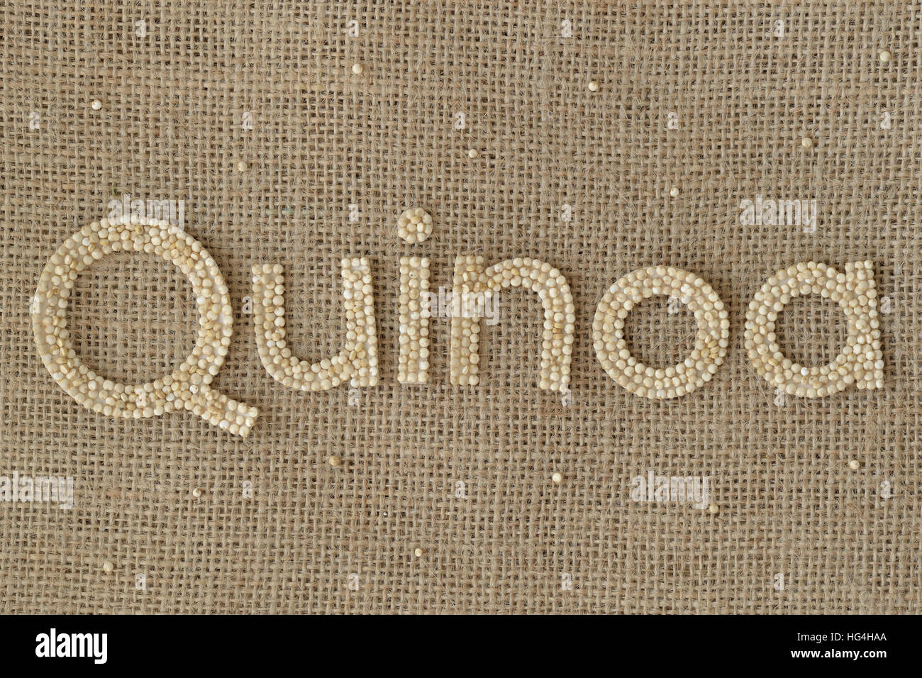 Quinoa written with raw grains Stock Photo - Alamy