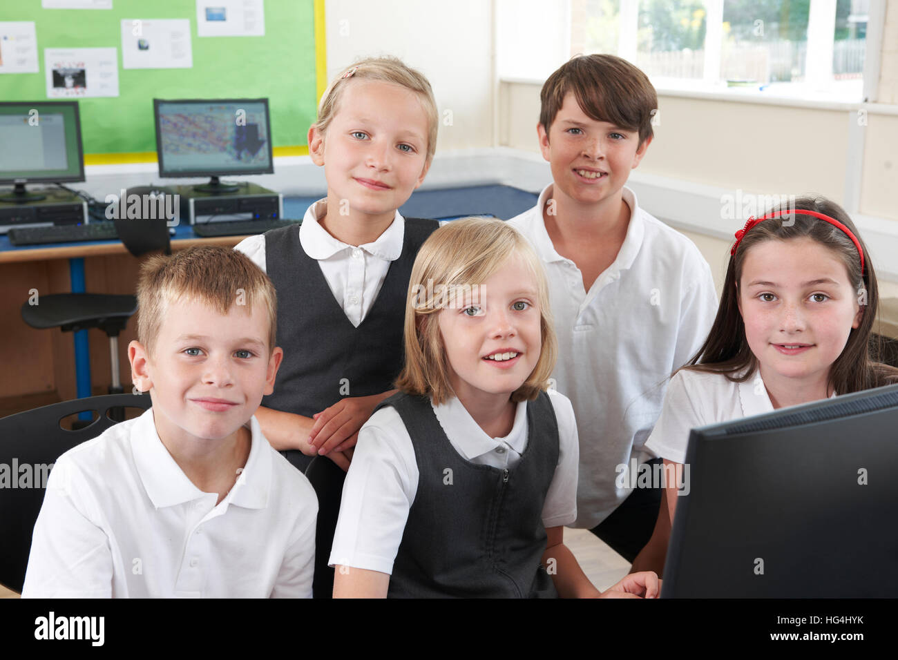 Portrait Of School Children In Computer Class Stock Photo - Alamy
