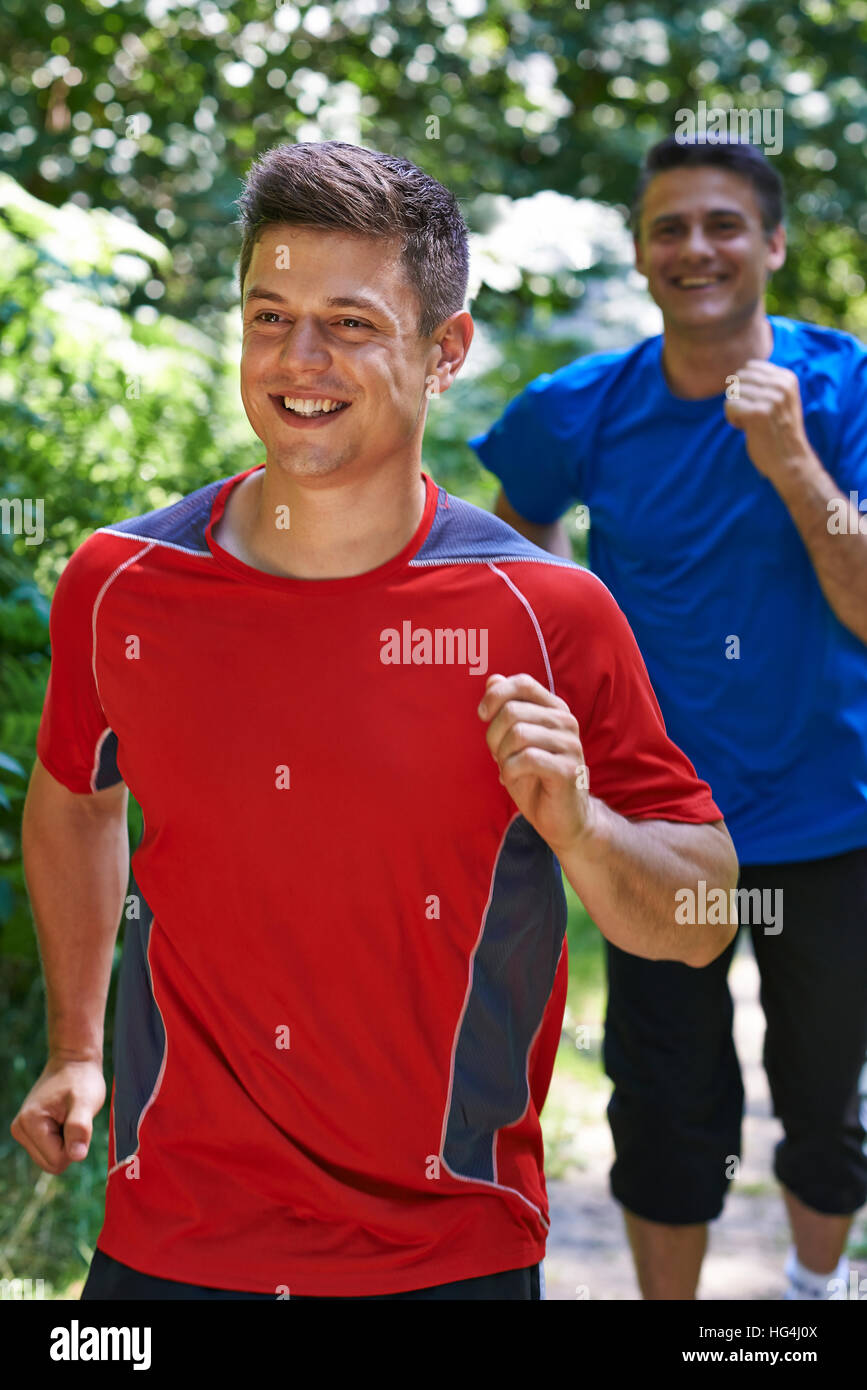 Two Men Running In Countryside Together Stock Photo - Alamy