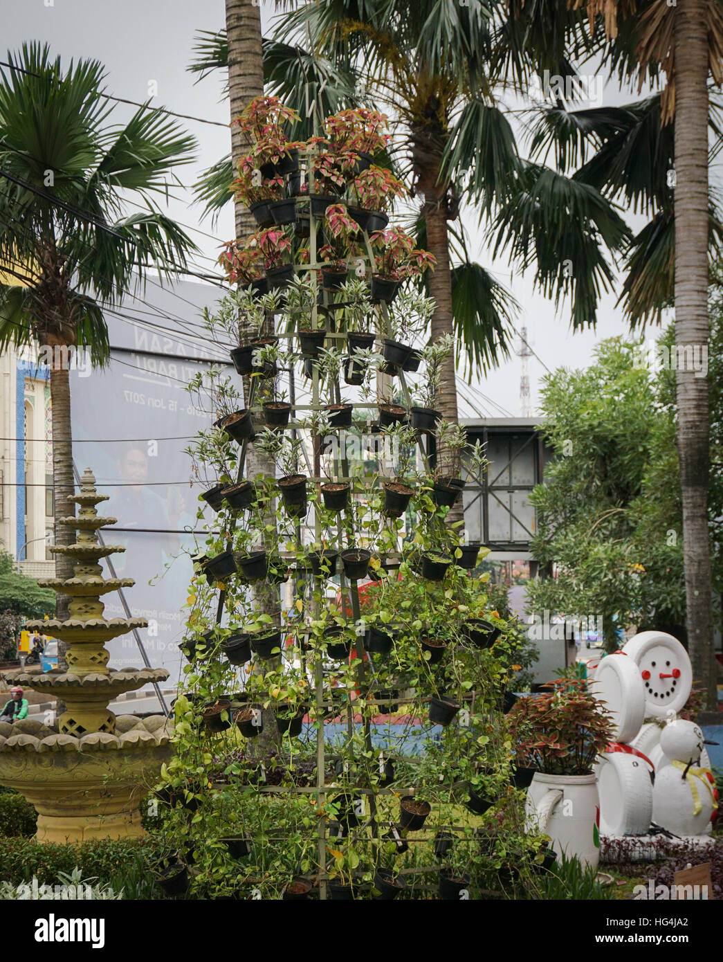 Stacking pots to build a green monument photo taken in Semarang ...