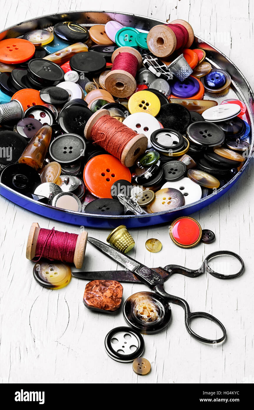 Threads for sewing and a set of buttons from clothing Stock Photo - Alamy