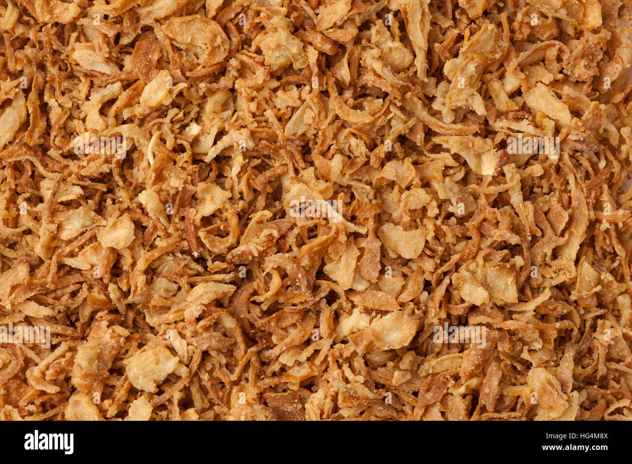 Golden baked onions full frame Stock Photo - Alamy