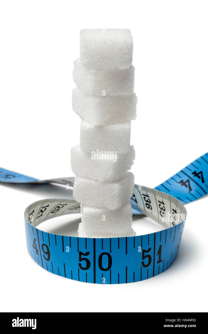 Tape measure around sugar cubes isolated on white background Stock ...