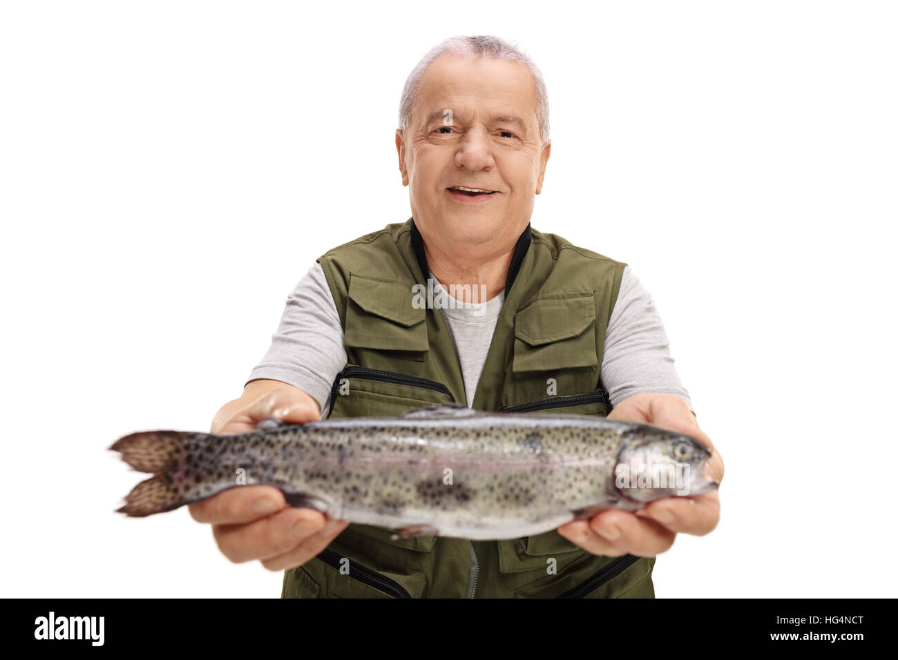 Elderly fisherman holding a fish isolated on white background Stock ...