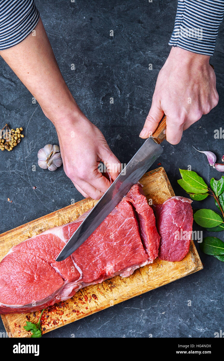 Cutting beef chef knife close hi-res stock photography and images - Alamy