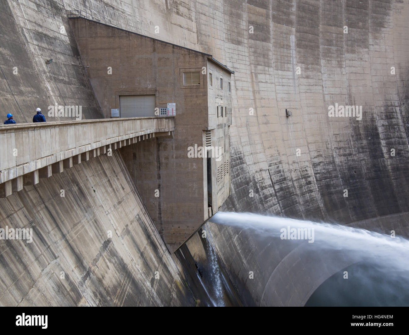 Release of water and two workers at impressive Katse Dam hydroelectric ...