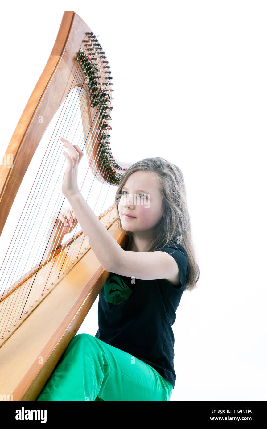 Child playing harp hi-res stock photography and images - Alamy