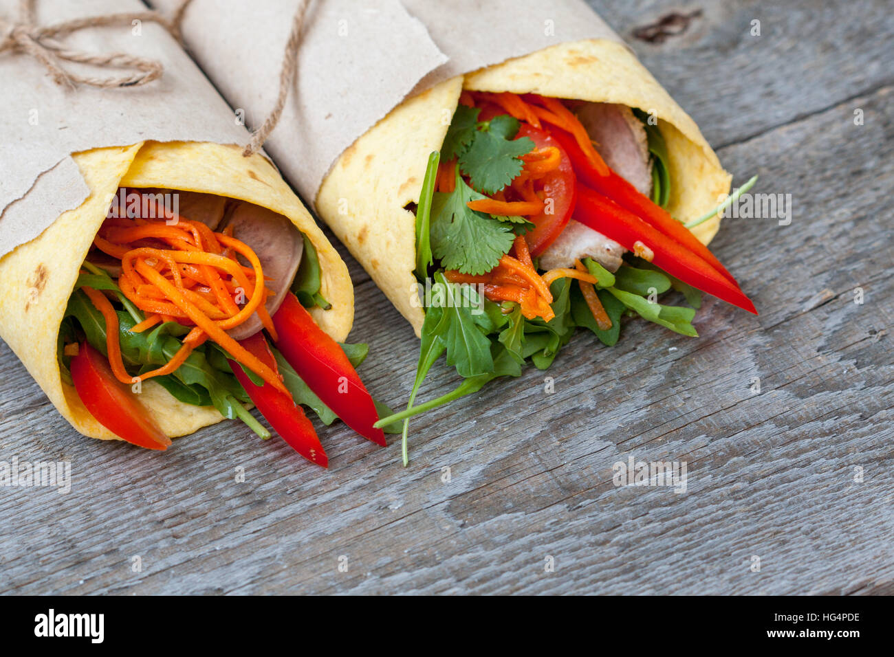 Various of tasty tortilla wraps on a wooden background. Healthy street ...