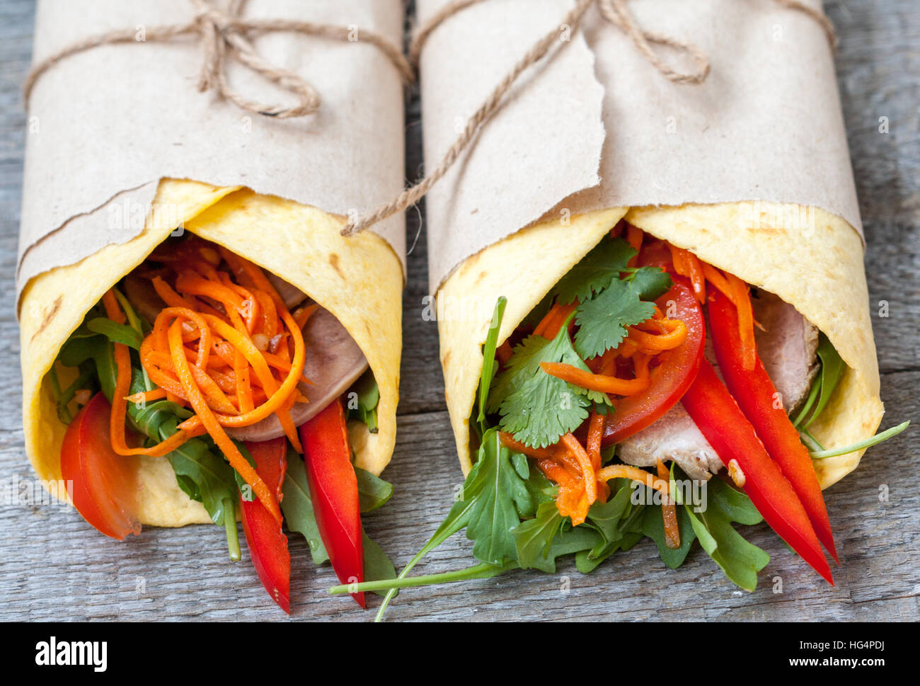 Various of tasty tortilla wraps on a wooden background. Healthy street ...