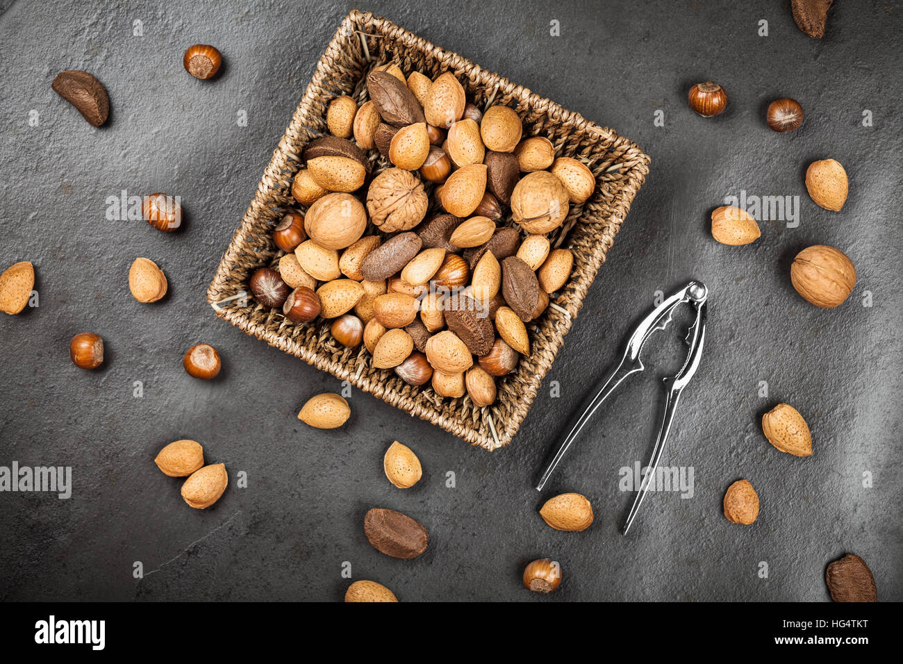 Assortment of nuts on dark slate background Stock Photo - Alamy