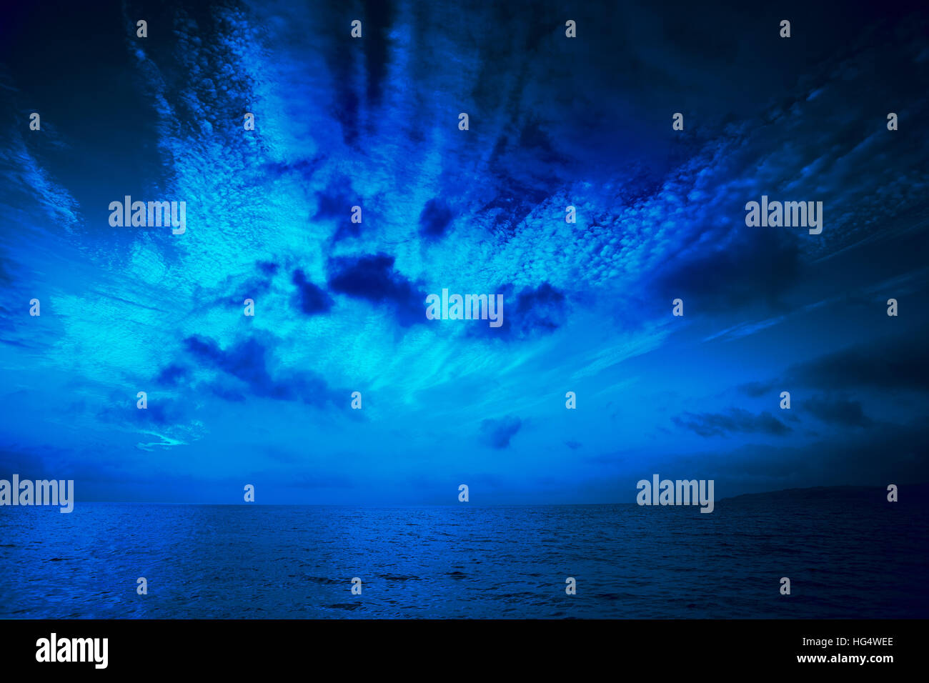 Early morning, sunrise over sea. Blue colored Stock Photo - Alamy