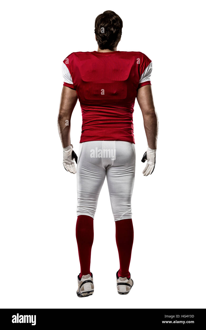 Football Player with a red uniform walking, showing his back on a white ...