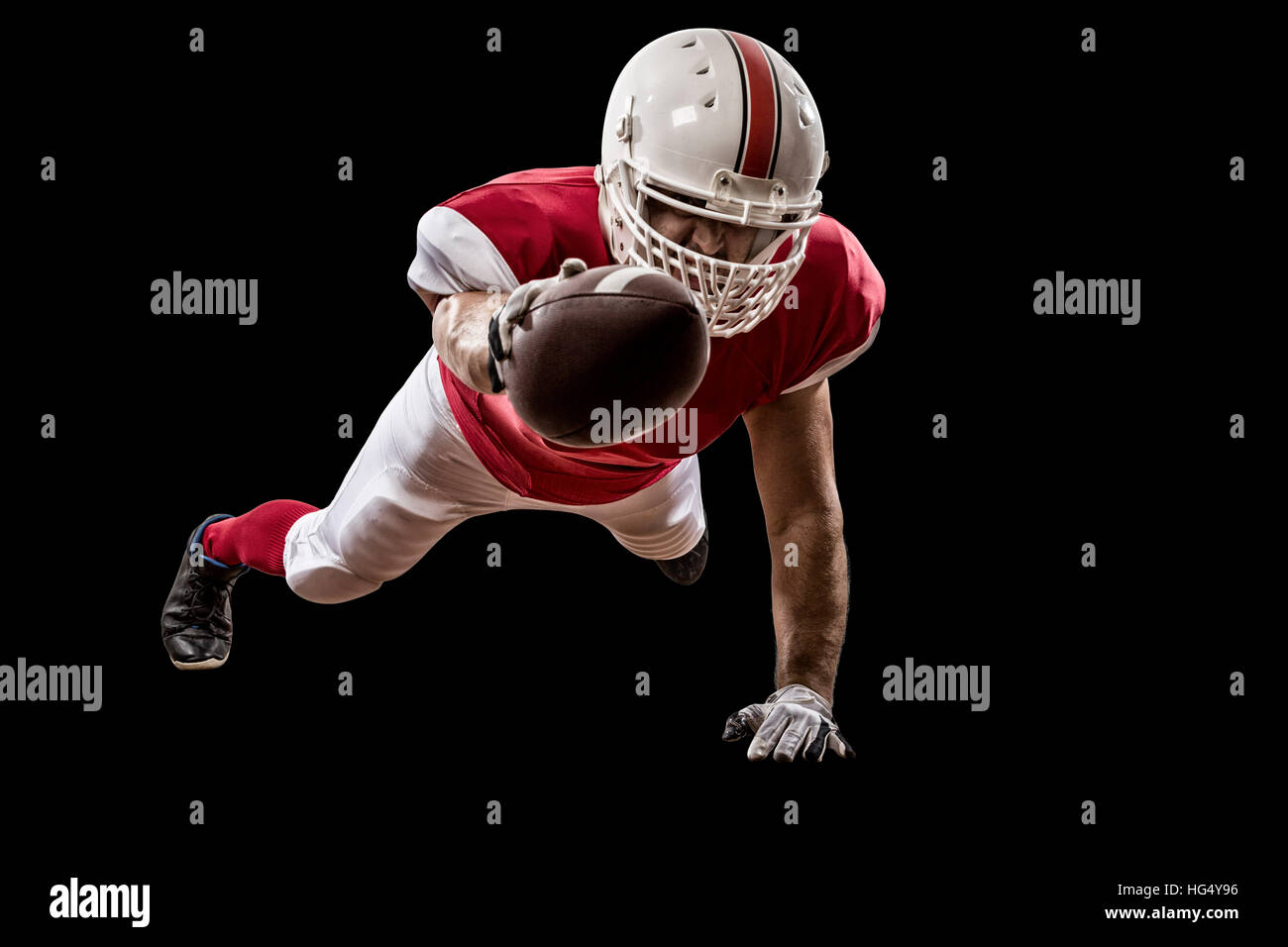 Football Player with a red uniform scoring on a Black background Stock ...