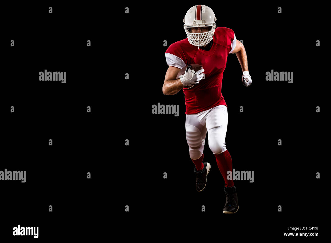 Football Player with a red uniform Running on a Black background Stock ...